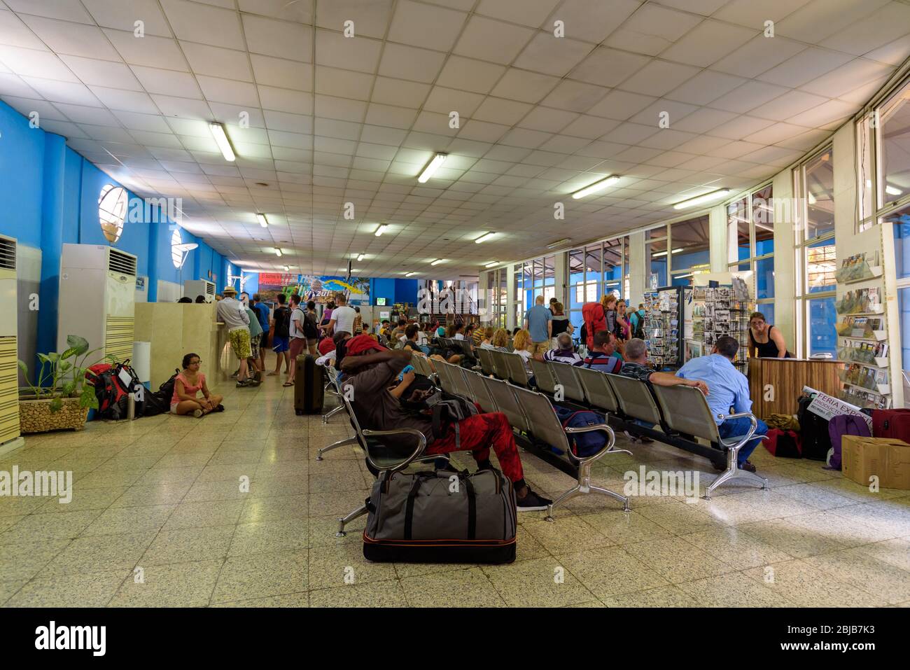 Tourists and locals inside the Capital Viazul bus terminal, from where ...