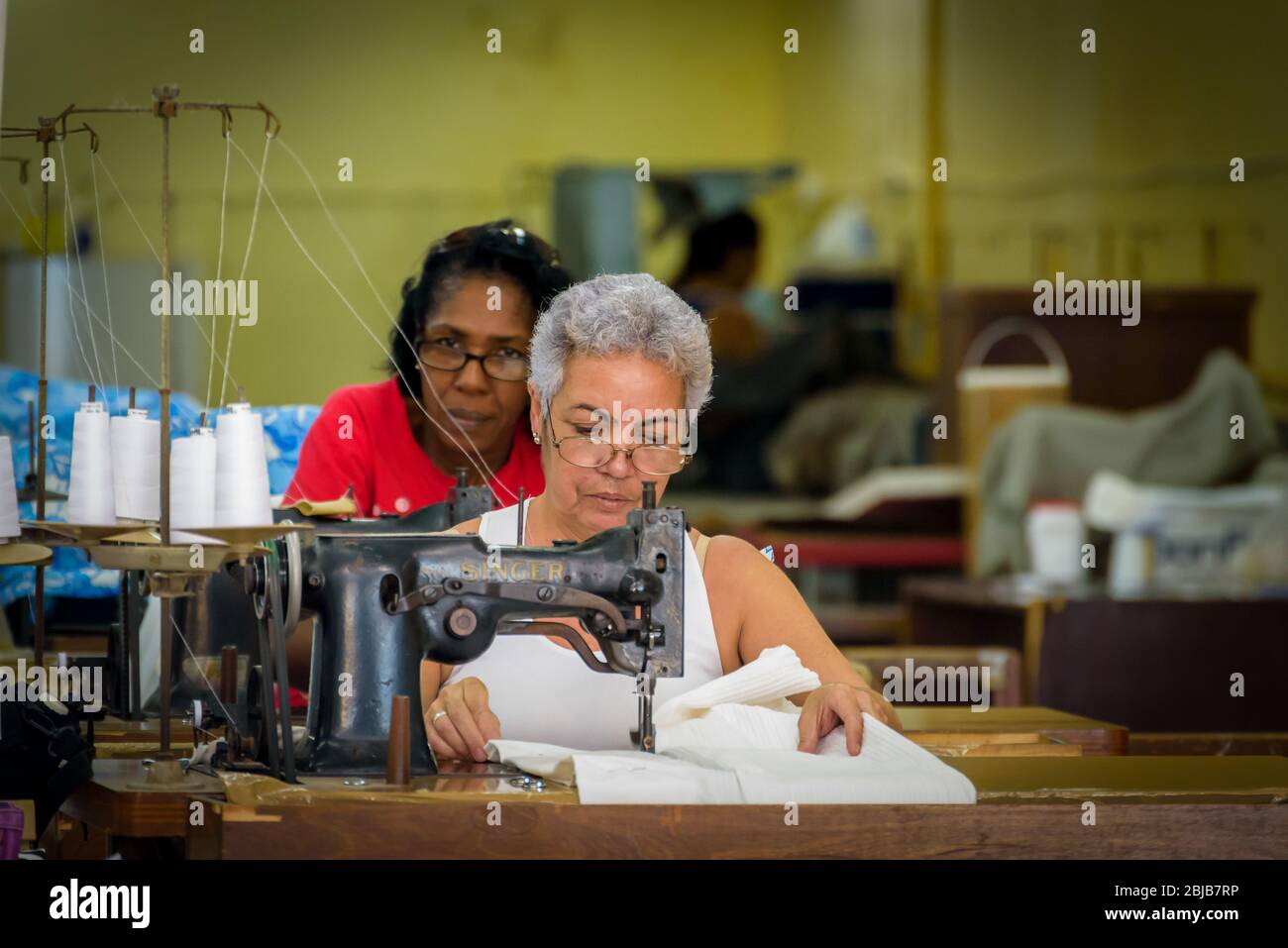 Havana, Cuba. Women at a garment factory, sewing company. Clothes ...