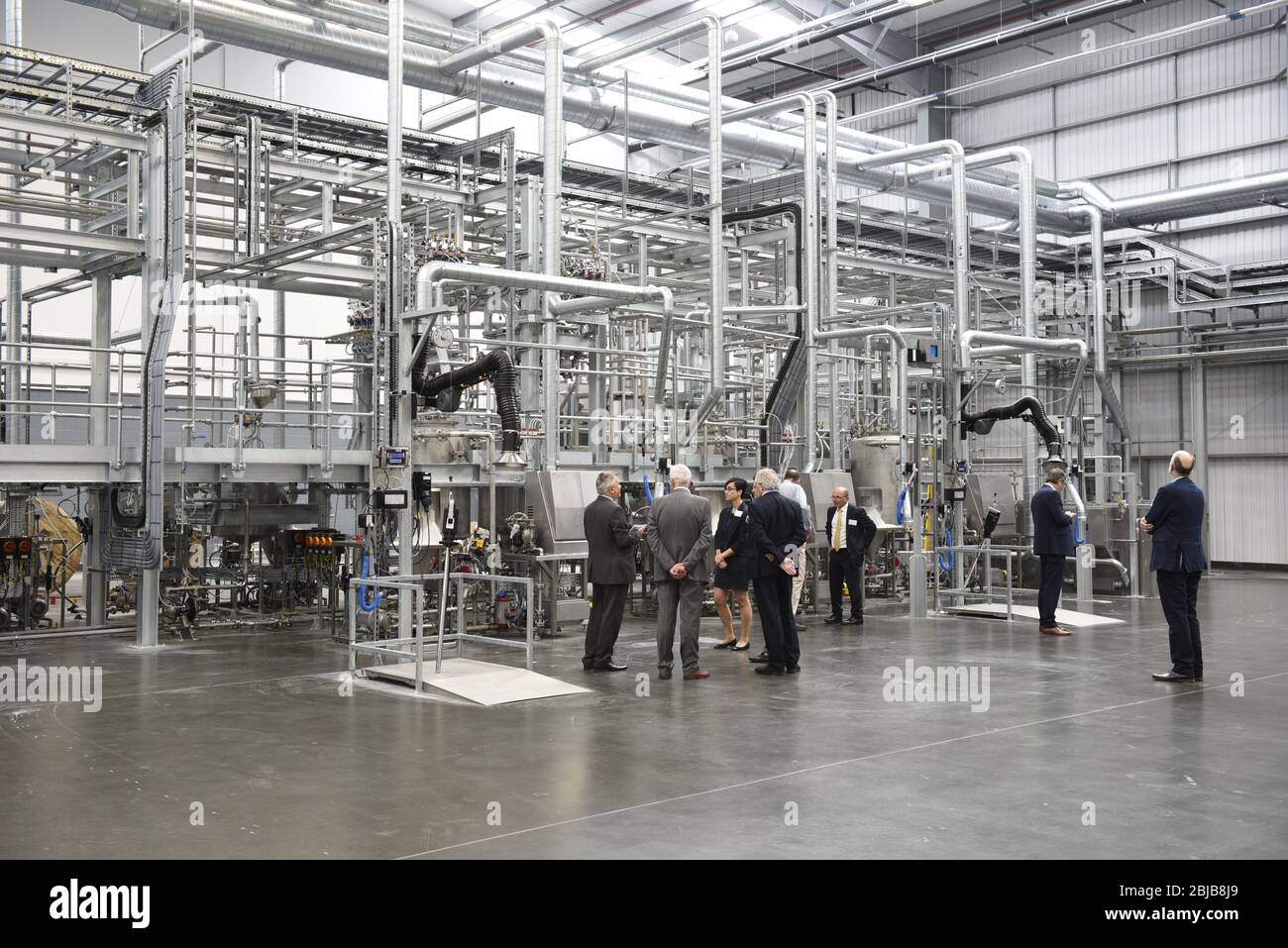 Business people tour a brand new factory in the UK Stock Photo - Alamy