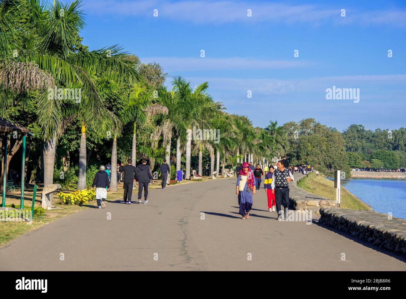 People promenarding Sukhna Lake Chandigarh Punjab India Stock Photo - Alamy