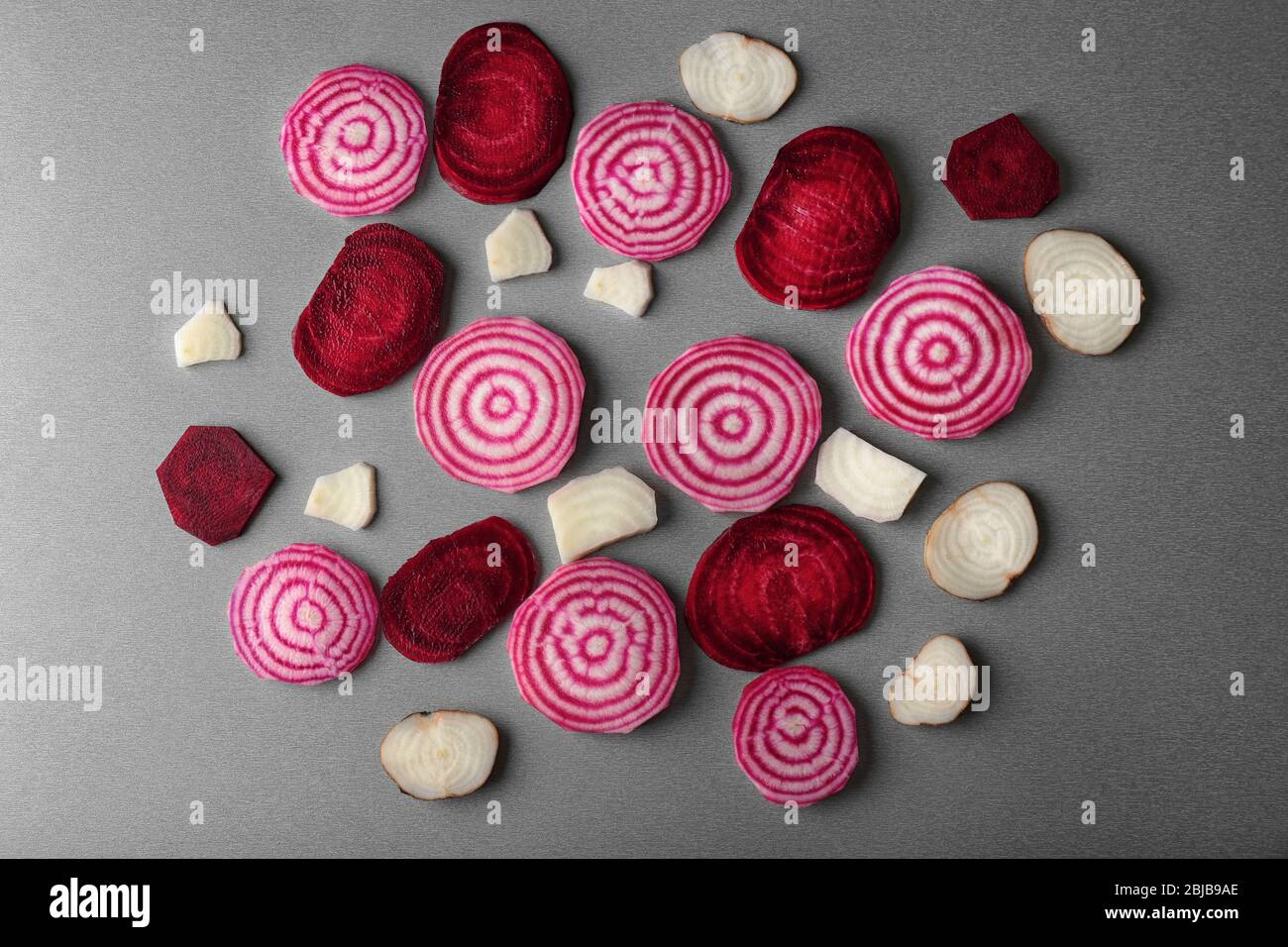 Fresh sliced beetroot on grey background, top view Stock Photo - Alamy