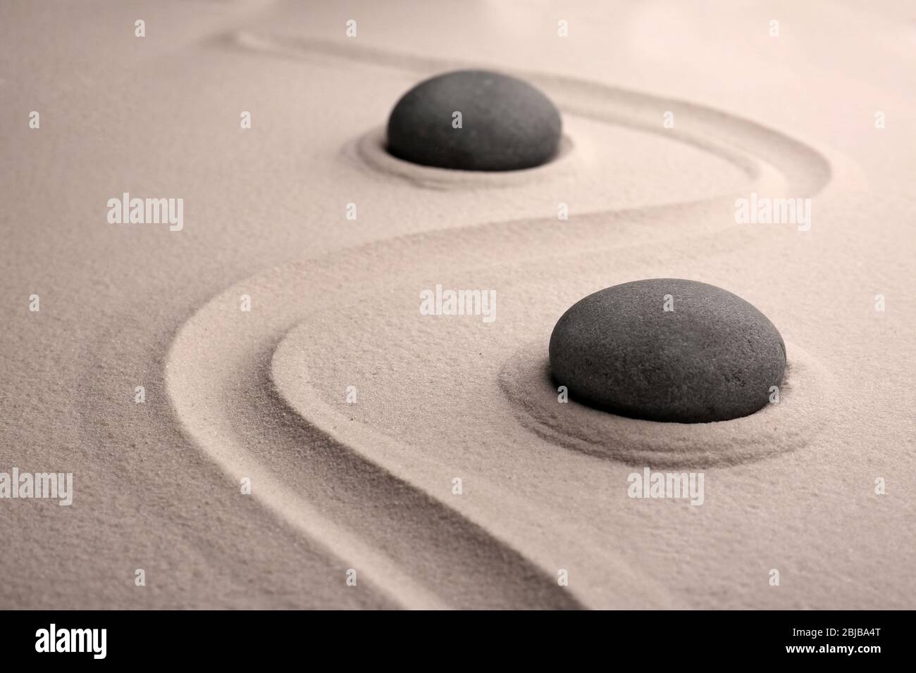 Zen stones on sand Stock Photo - Alamy