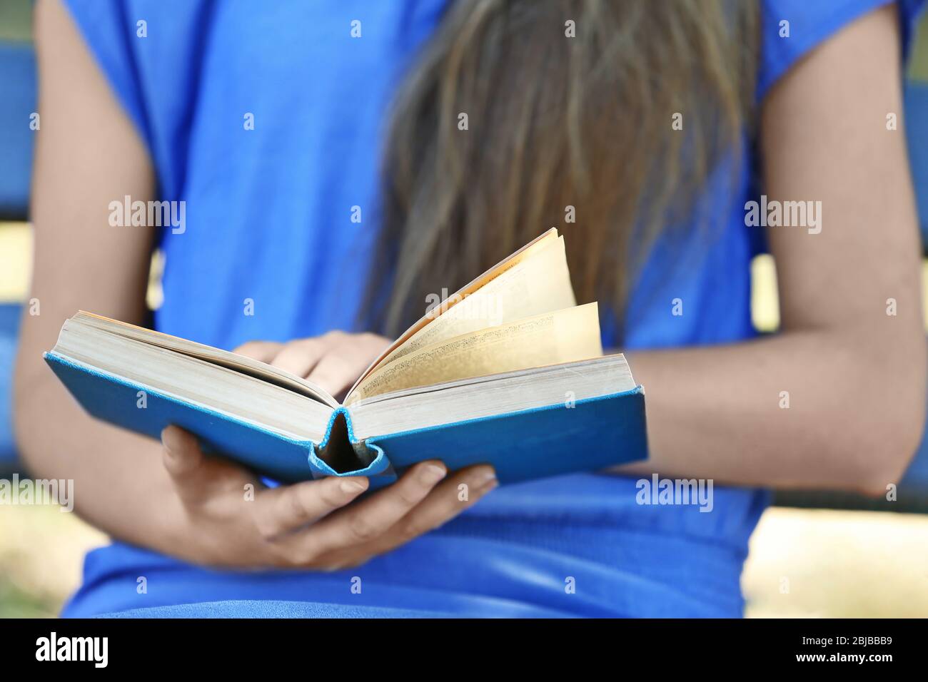 Hands closing a book hi-res stock photography and images - Alamy