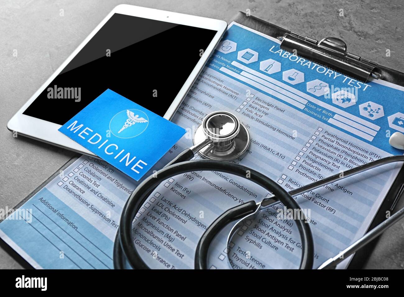 Medical service concept. Visiting card, clipboard, stethoscope and ...