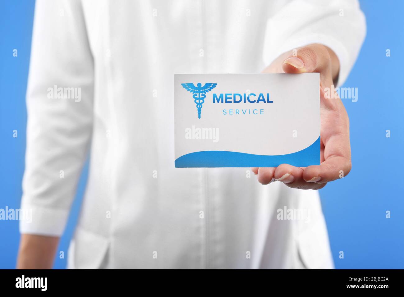 Medical service concept. Female hand holding visiting card Stock Photo ...