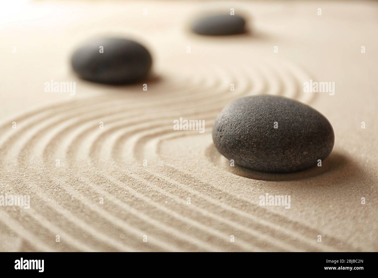 Japanese Zen garden. Pebbles on a sand Stock Photo - Alamy