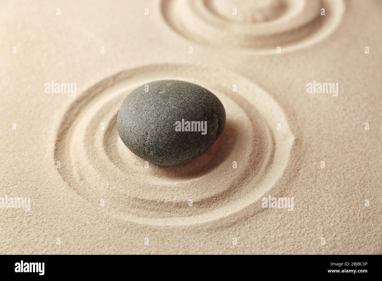 Japanese Zen garden. Pebble on a sand Stock Photo - Alamy