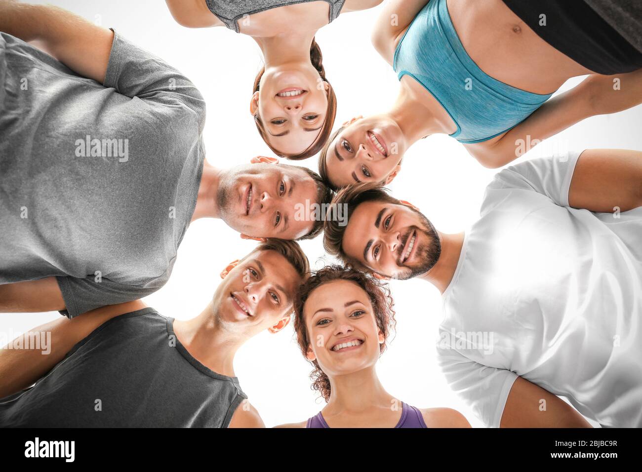 Team work concept. Group of people standing head to head Stock Photo ...
