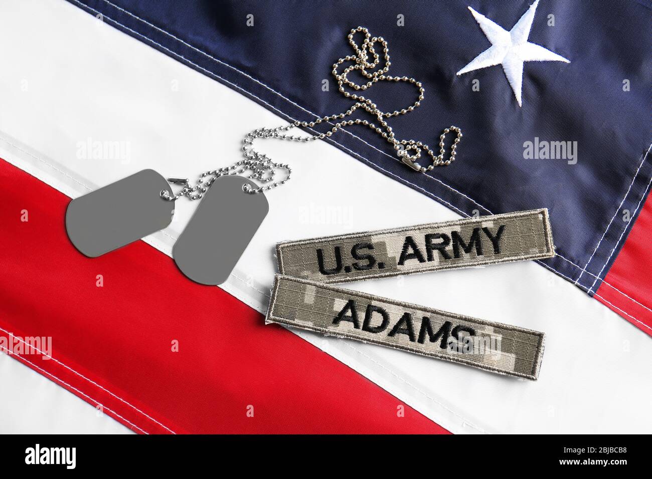 Army tokens and patches on American national flag background Stock ...