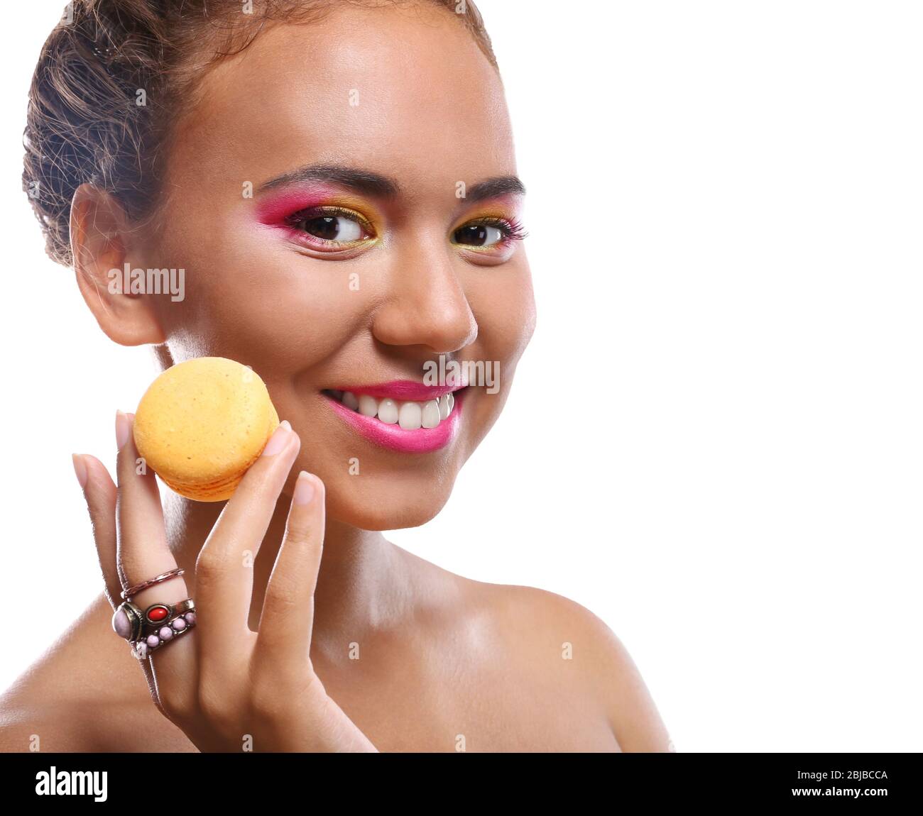 Young woman with tasty macaroon on white background Stock Photo - Alamy