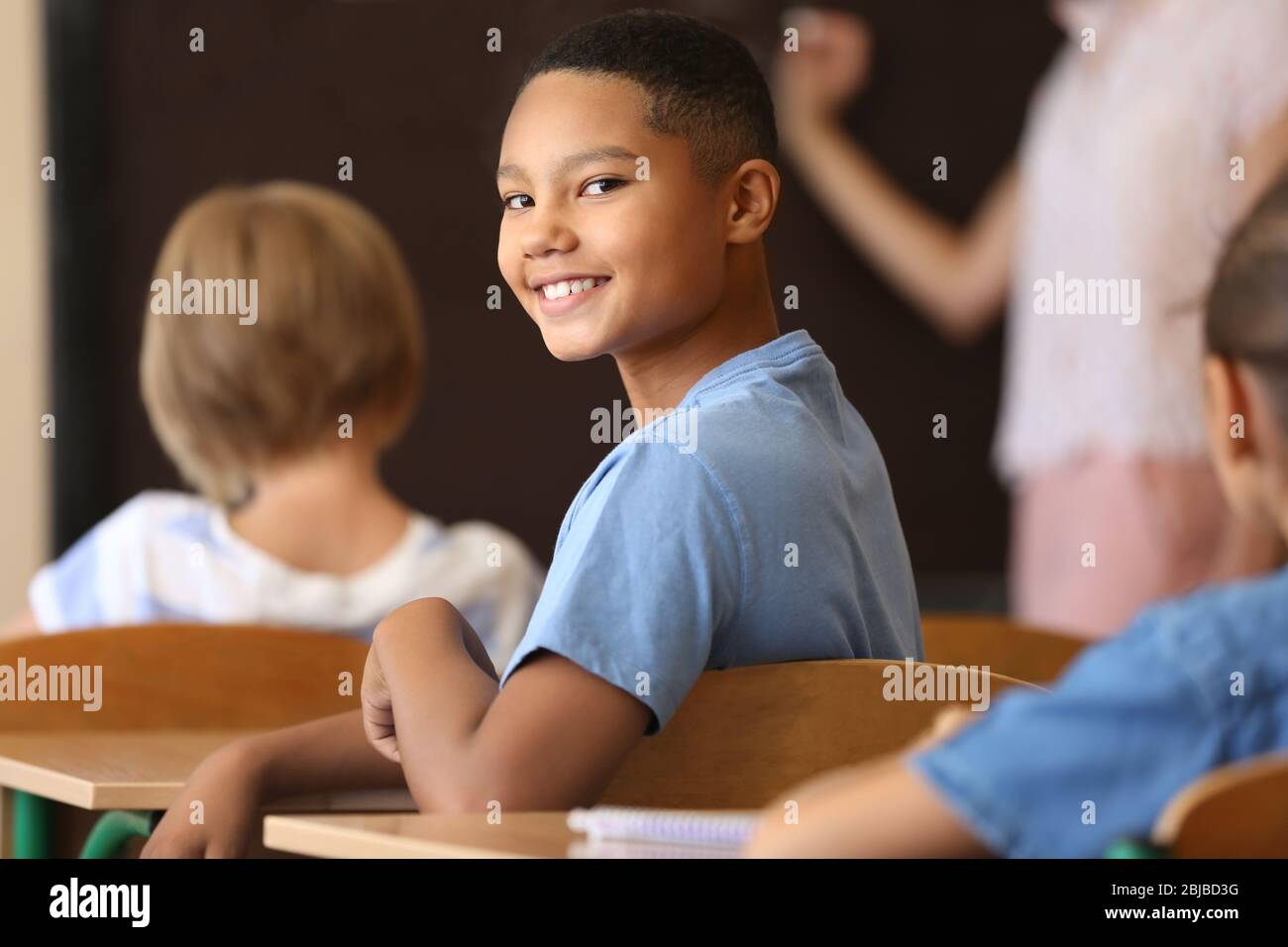 African American boy on lesson in classroom Stock Photo - Alamy
