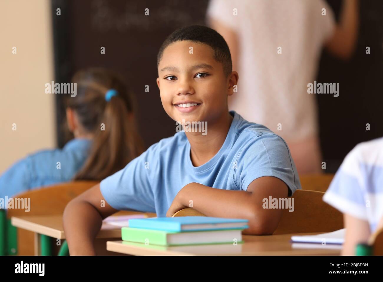 African American boy on lesson in classroom Stock Photo - Alamy