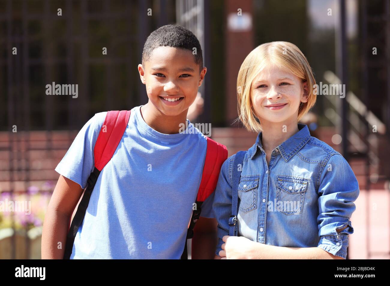 Cute kids standing hi-res stock photography and images - Alamy