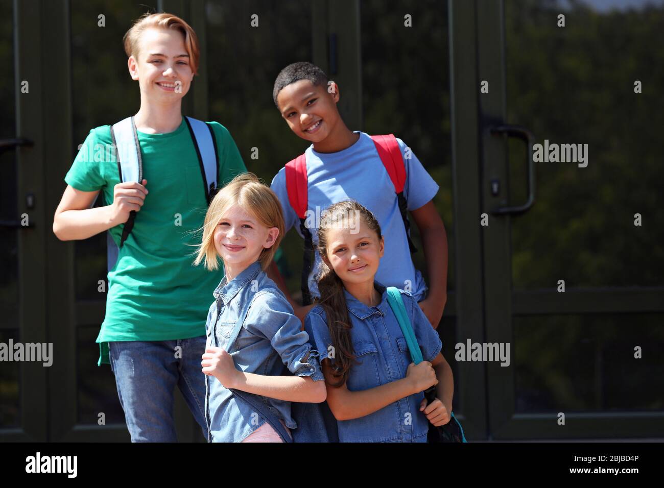 Cute kids standing hi-res stock photography and images - Alamy