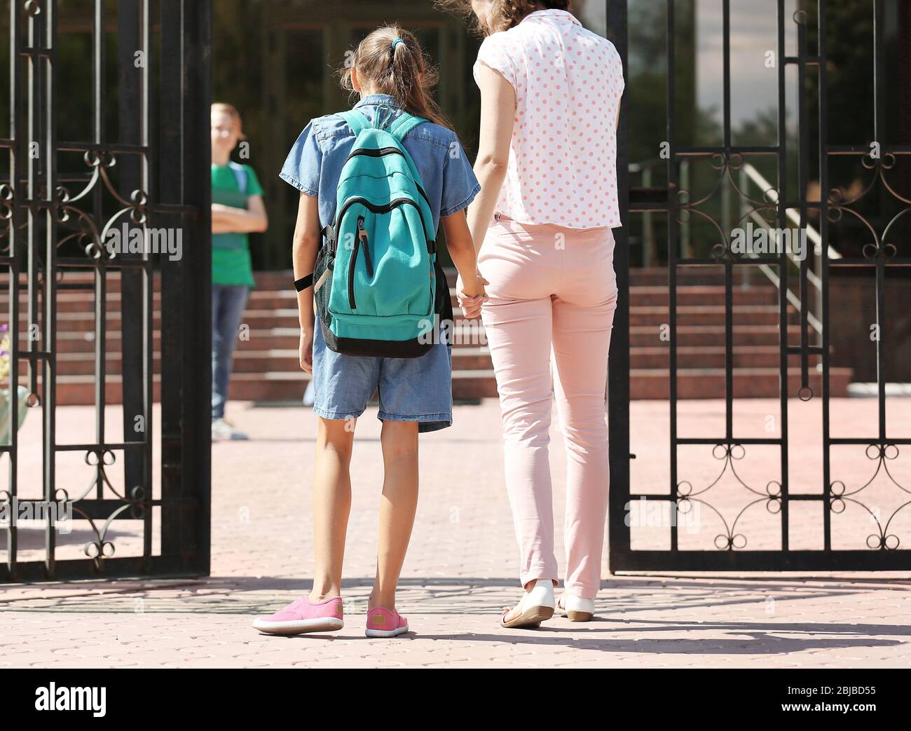 Parent taking child to school Stock Photo - Alamy
