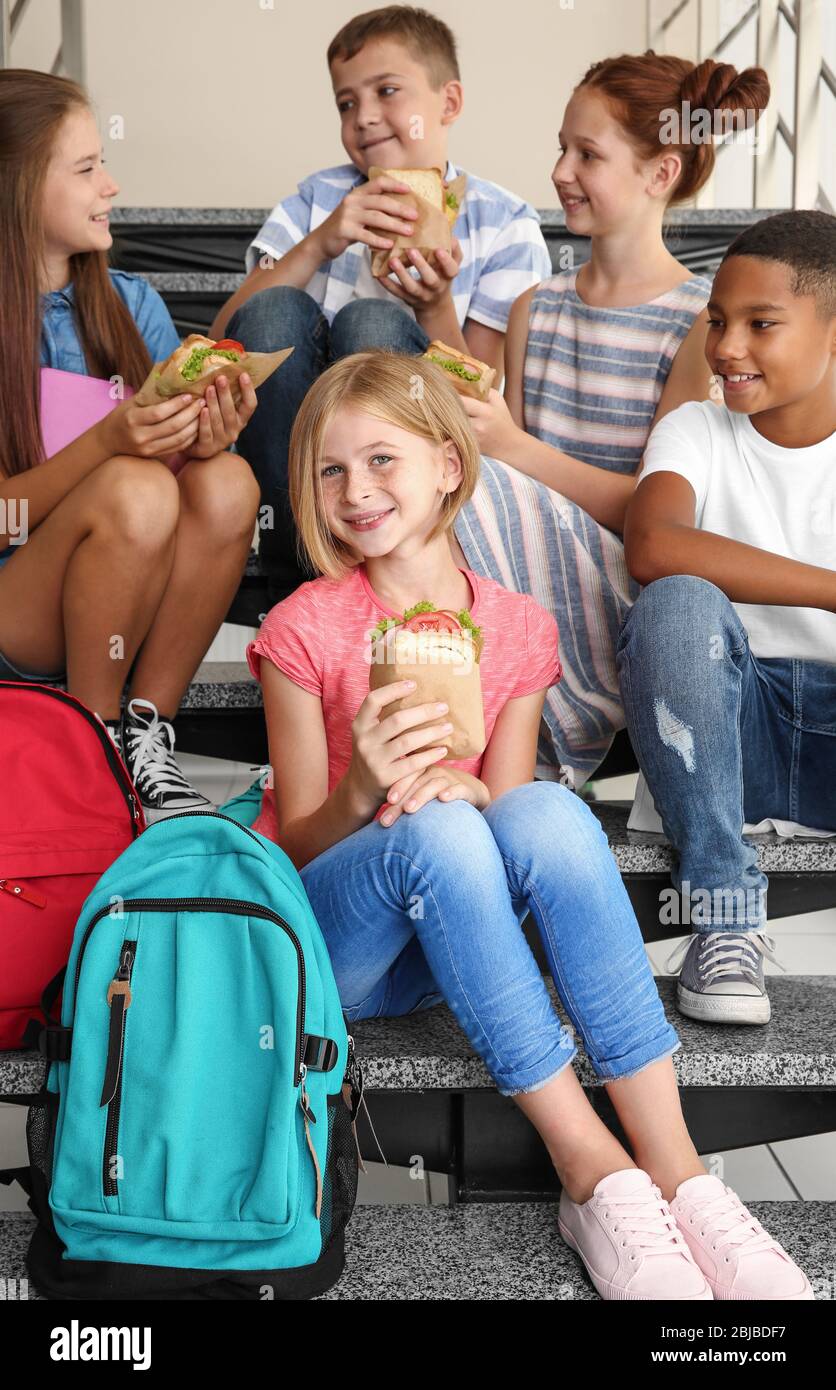 Children sitting on steps eating hi-res stock photography and images ...