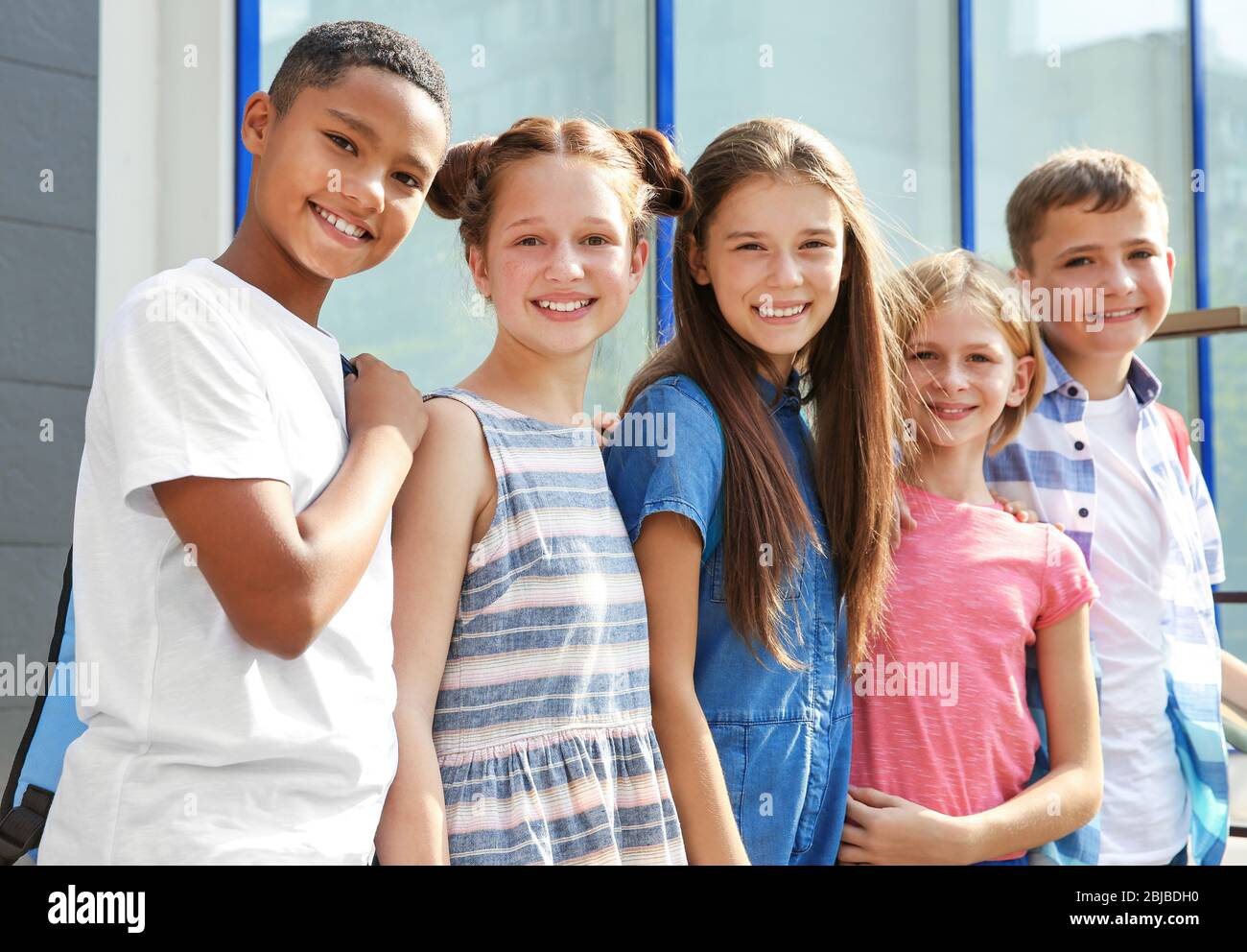 Group of pupils standing outdoors near school Stock Photo - Alamy