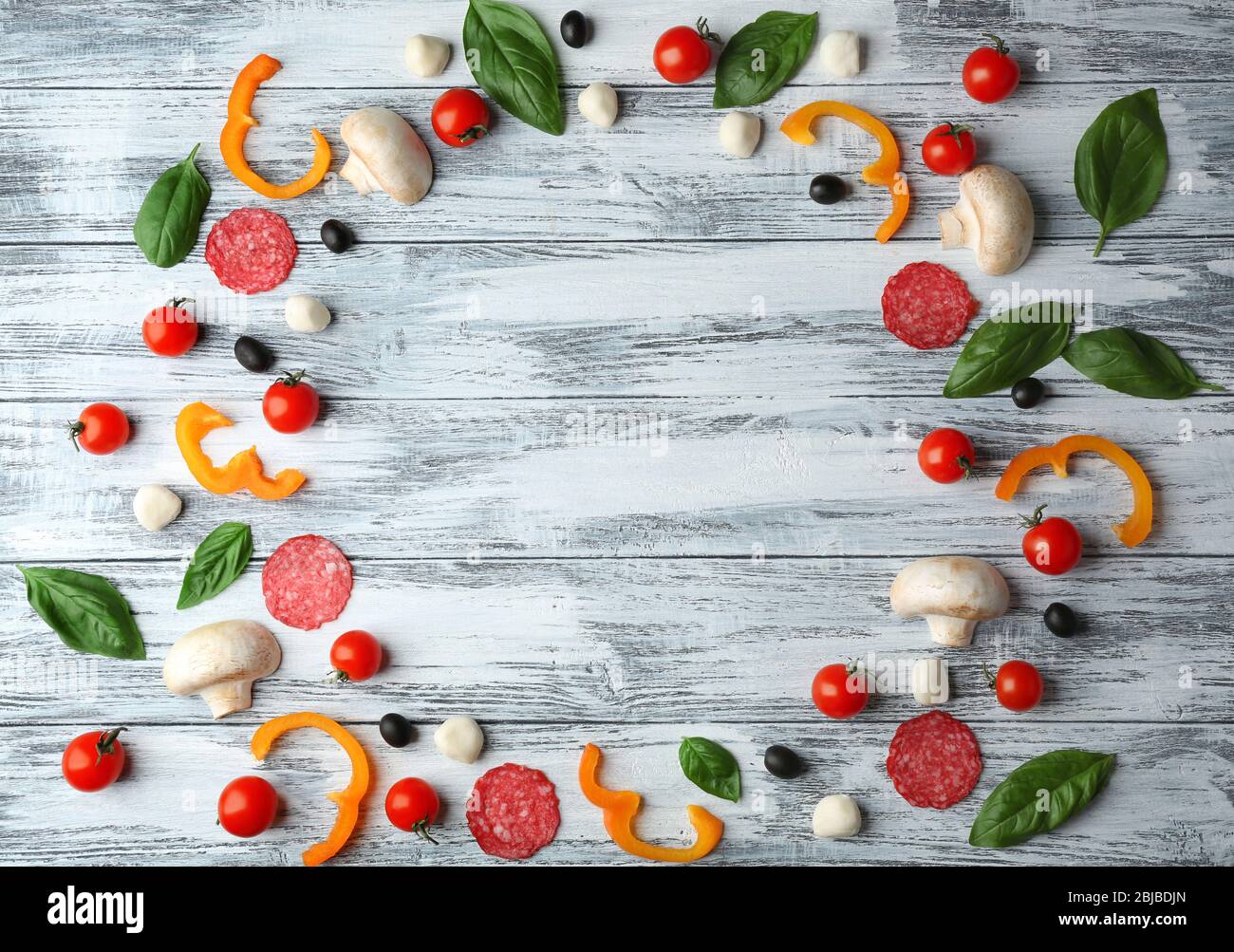 Raw pizza ingredients on wooden background, top view Stock Photo - Alamy