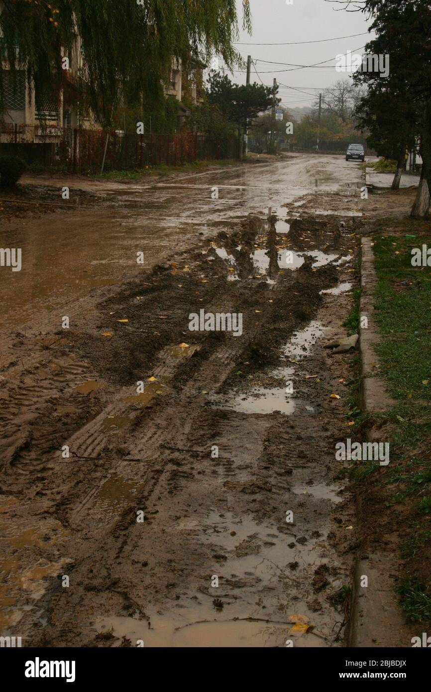 Muddy puddle road after rain hi-res stock photography and images - Alamy