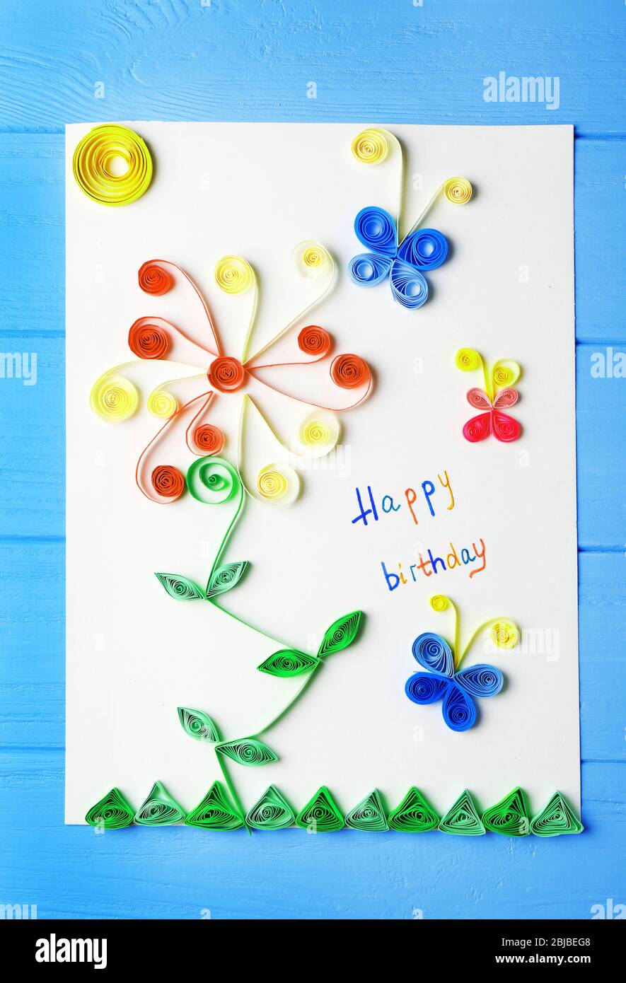 Fancy gift card on blue wooden background Stock Photo - Alamy