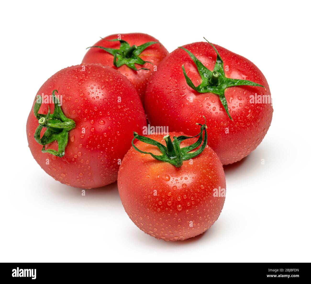 Four tomatoes on plant Cut Out Stock Images & Pictures - Alamy