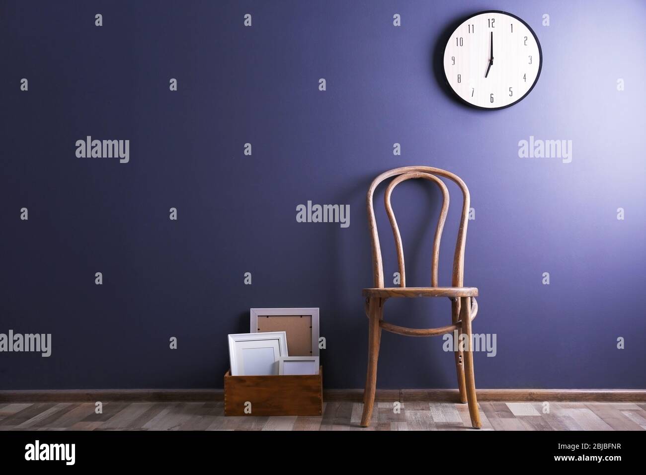 Stylish chair with decorations on dark wall background Stock Photo - Alamy
