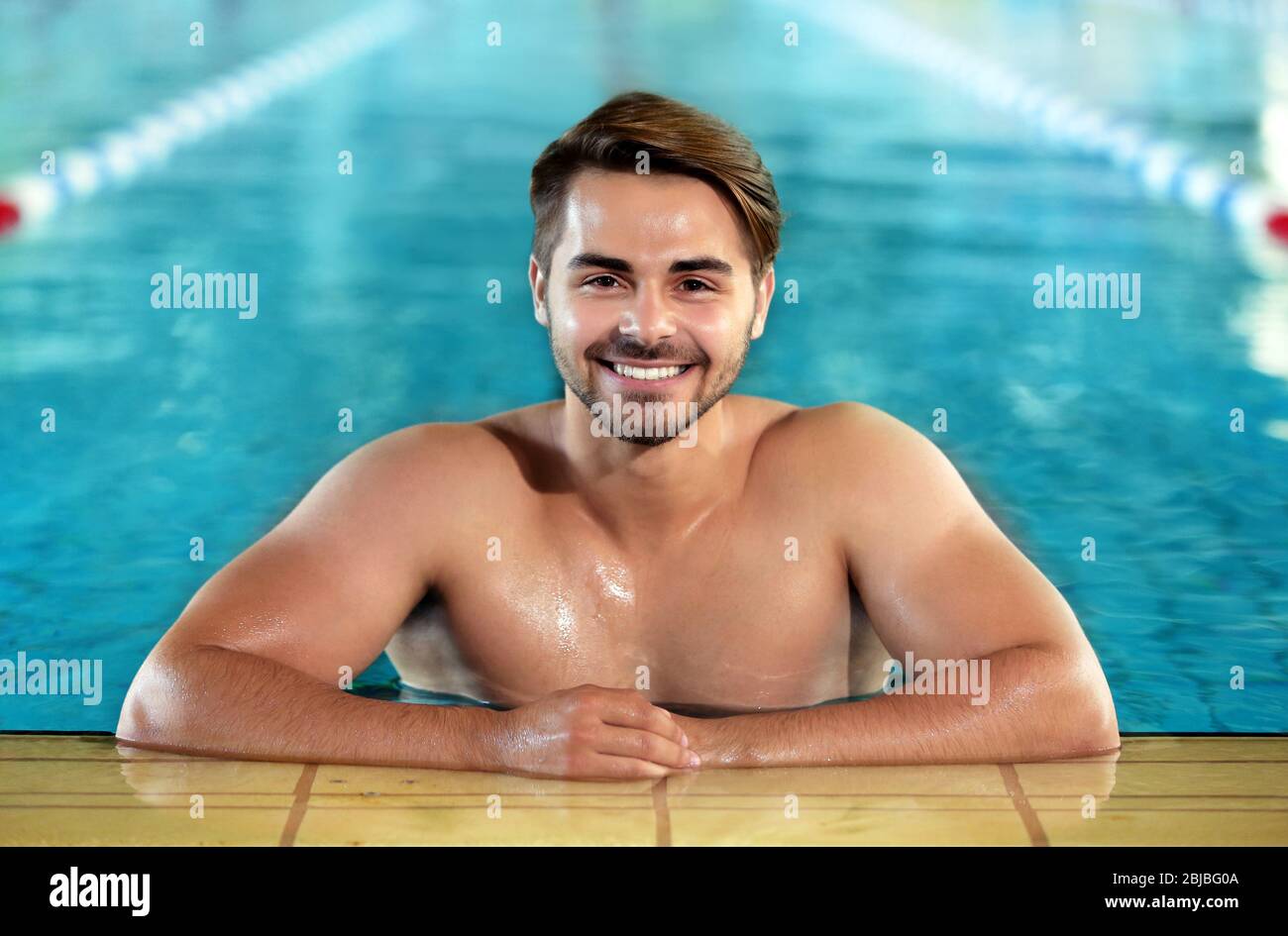 Young man in swimming pool Stock Photo - Alamy
