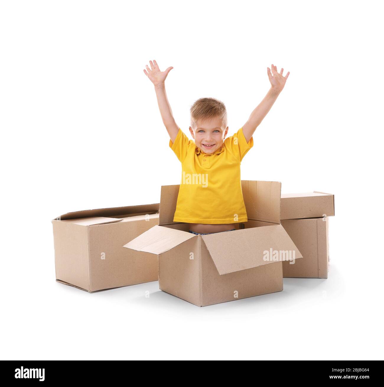 Little boy playing with cardboard boxes isolated on white Stock Photo ...