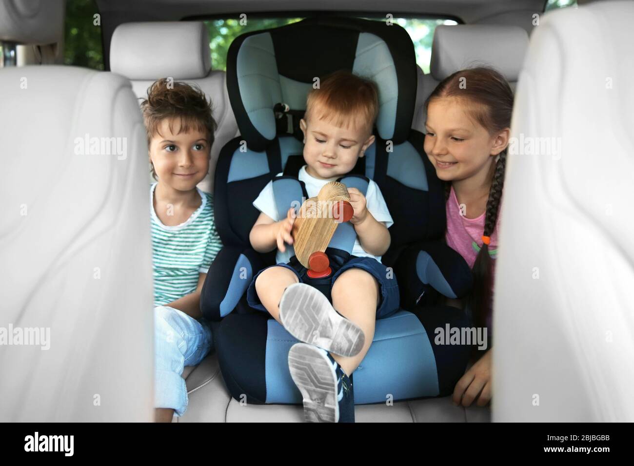 Happy children in car Stock Photo - Alamy