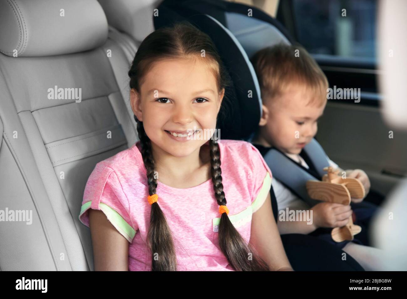 Happy children in car Stock Photo - Alamy