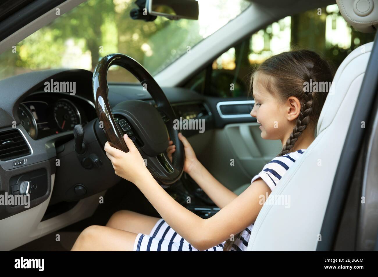 Girl driving parent car Stock Photo - Alamy