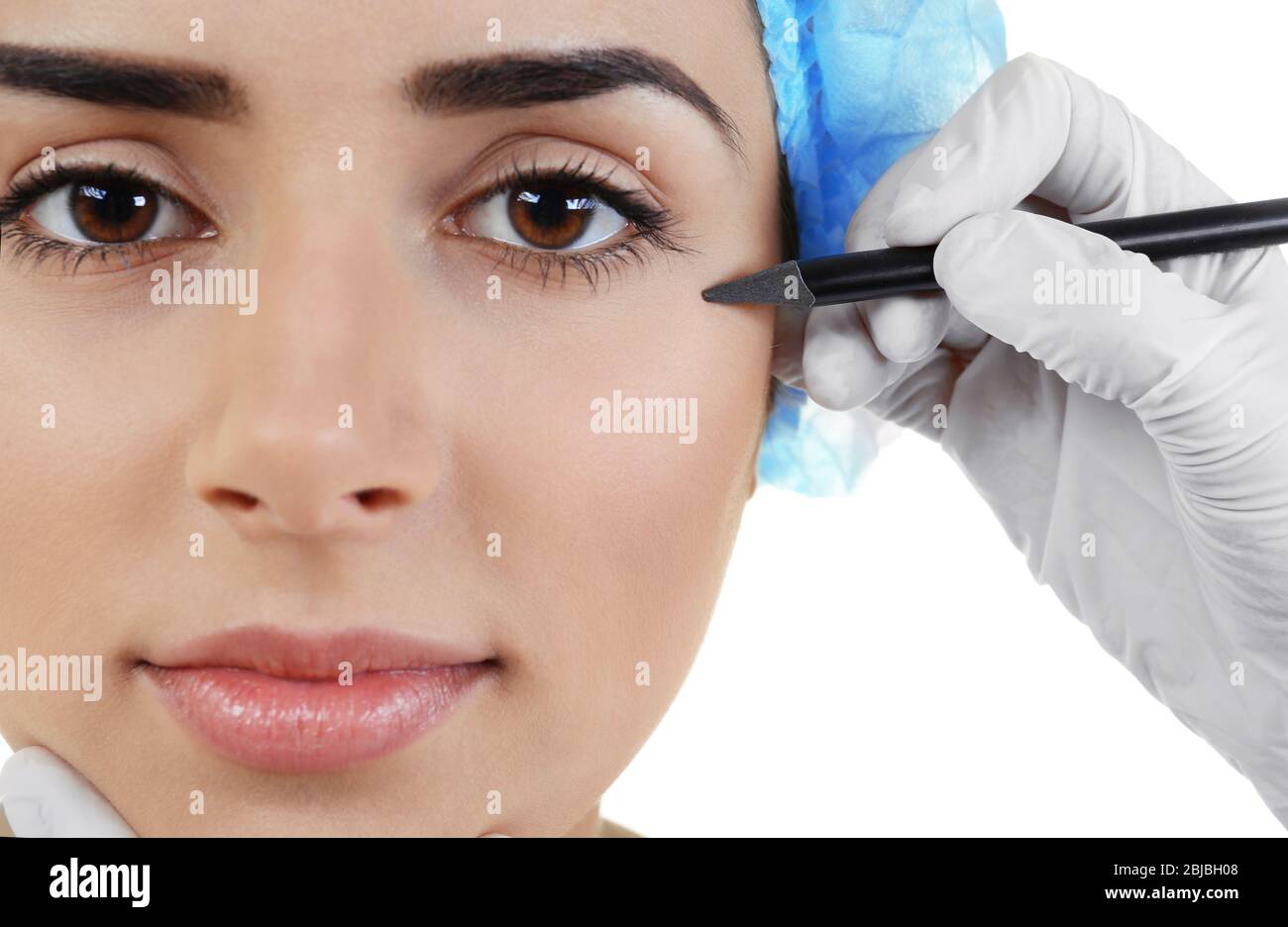 Plastic surgery concept. Hand in glove marking women face Stock Photo ...