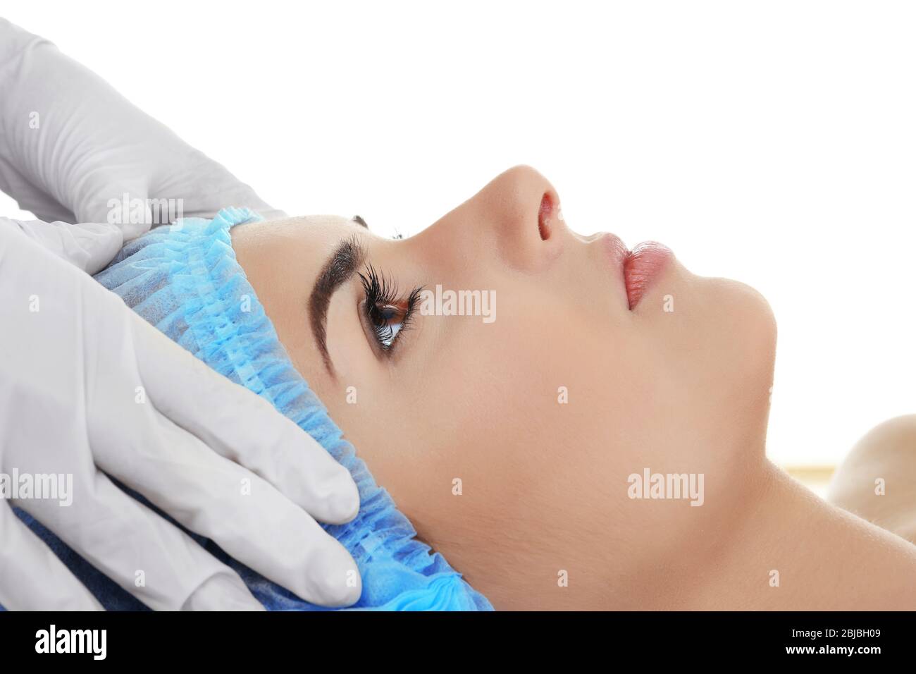 Plastic surgery concept. Doctor checking female face before plastic ...