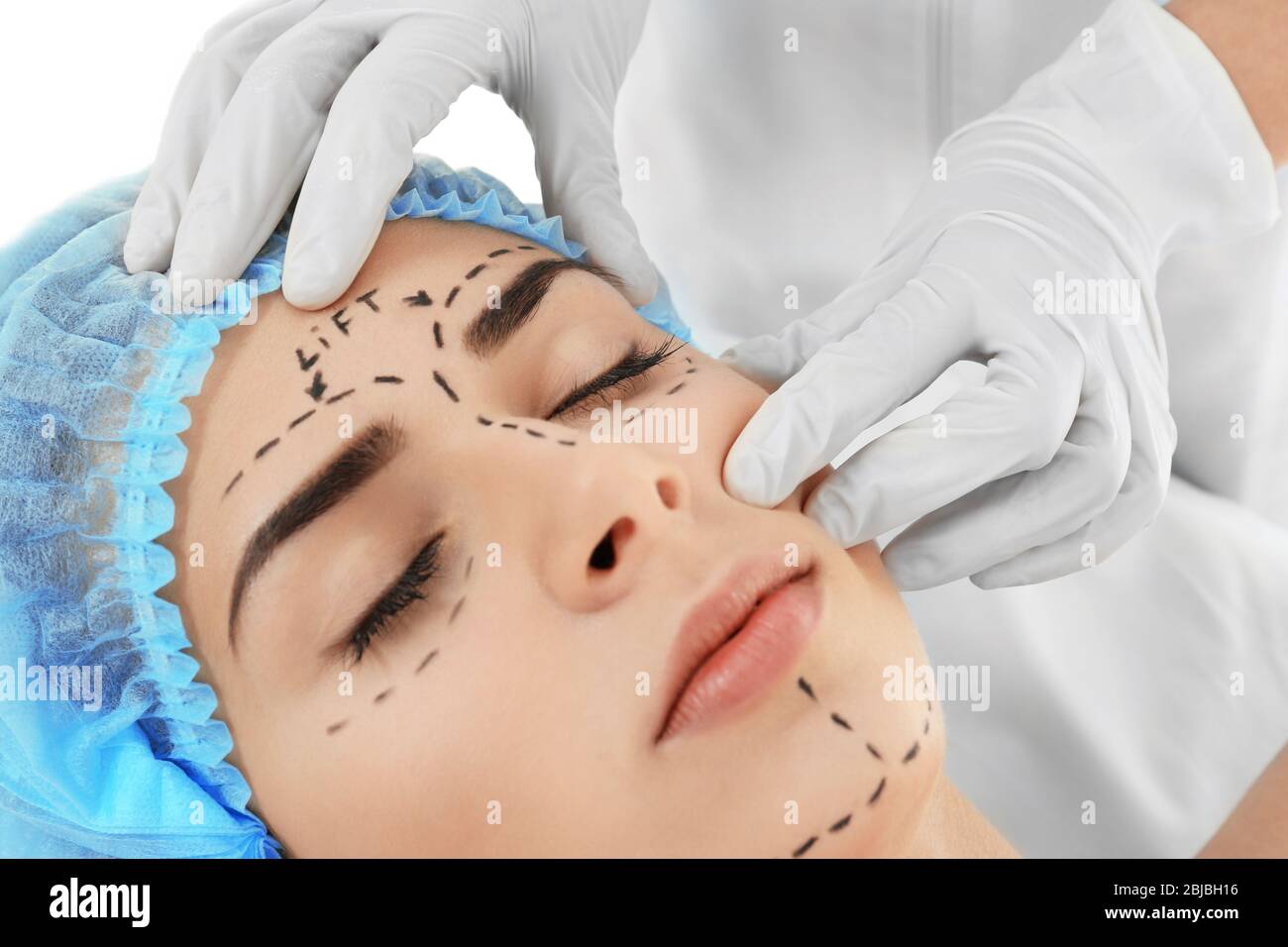 Plastic surgery concept. Specialist checking female face Stock Photo ...