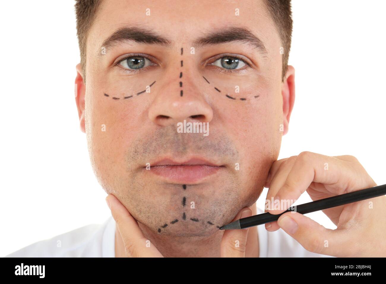 Plastic surgery concept. Hands marking male face Stock Photo - Alamy