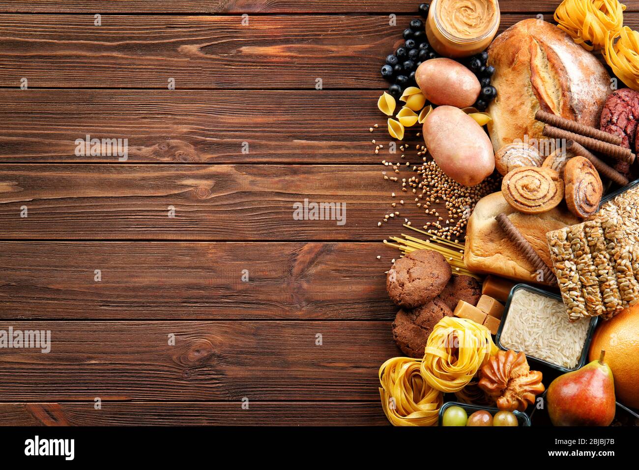 Set of different products on wooden background Stock Photo - Alamy