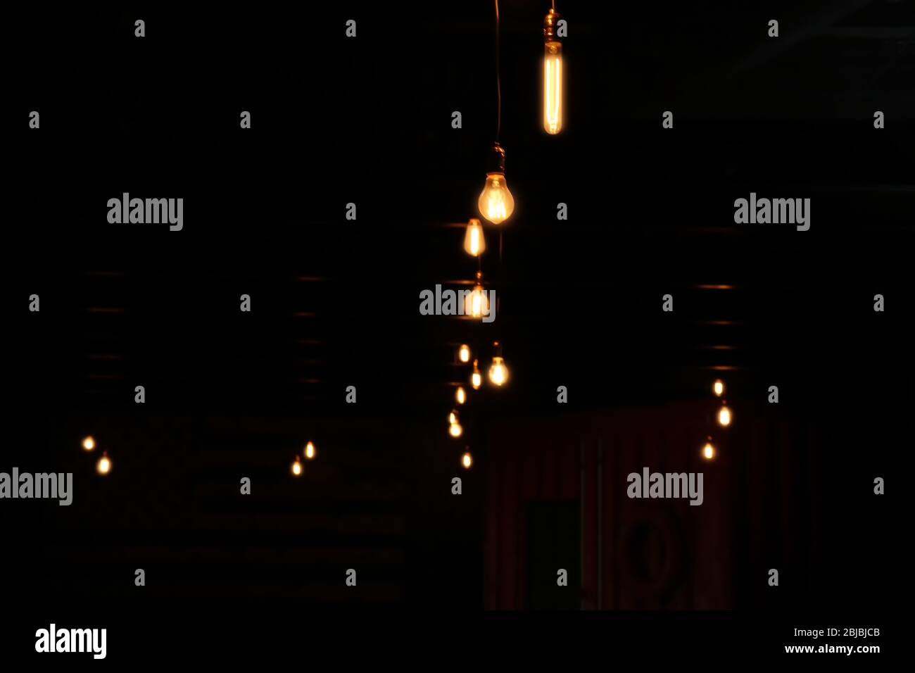 Decorative lighting. Bright lamps in the dark Stock Photo - Alamy