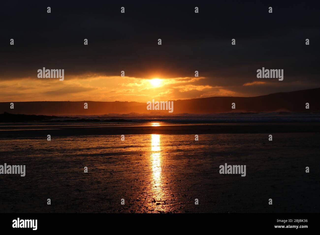 Cloudy Winter Sunset over Polzeath Beach, Cornwall, UK Stock Photo - Alamy