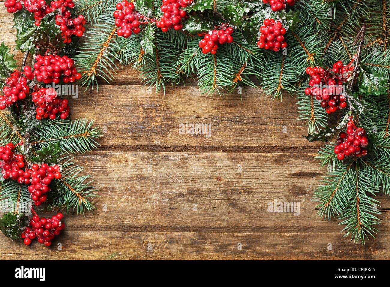Christmas fir tree on wooden background Stock Photo - Alamy