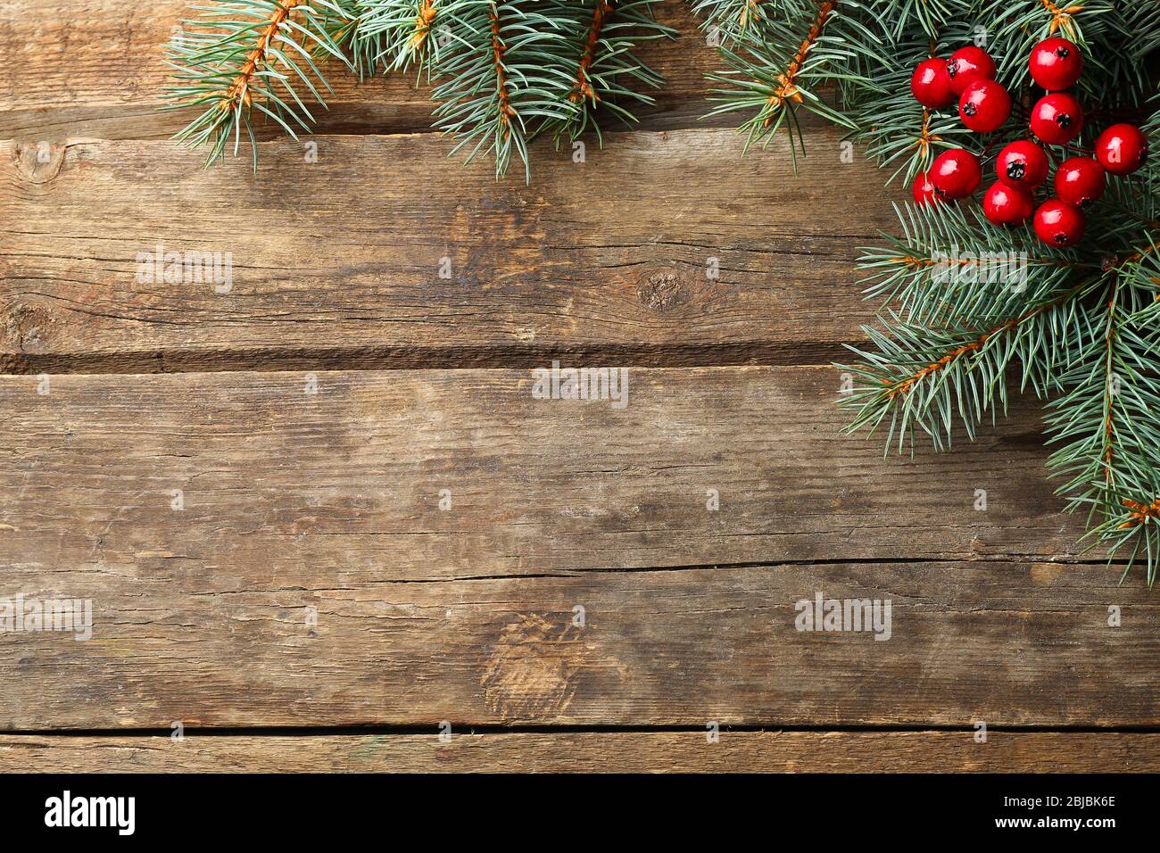 Christmas fir tree on wooden background Stock Photo - Alamy
