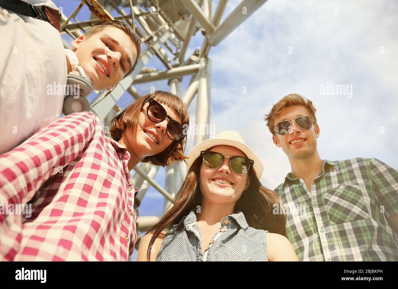 Happy friends hanging out on sunny day outdoor Stock Photo - Alamy