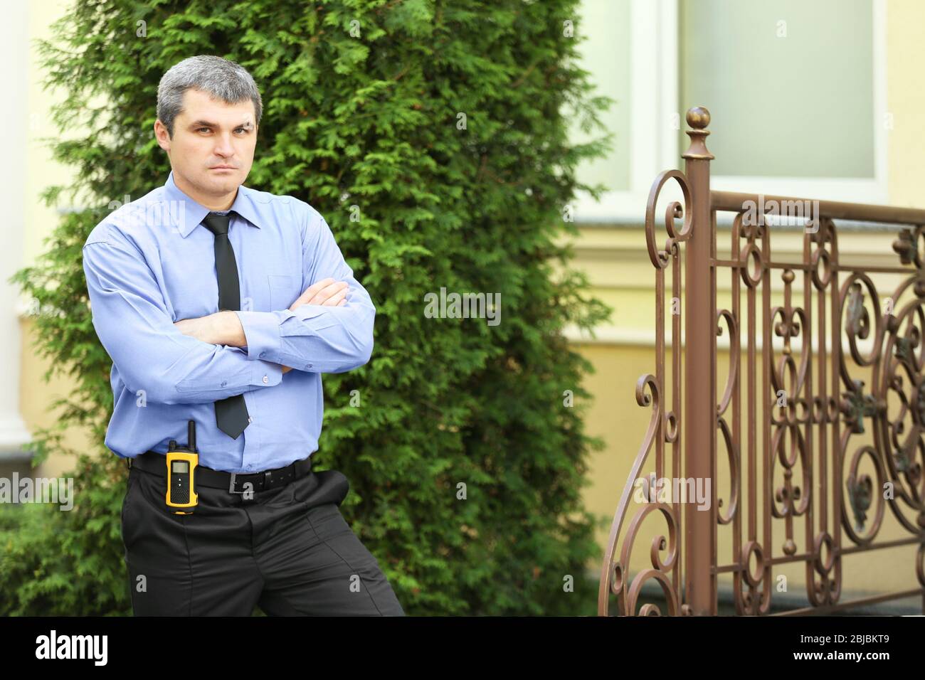 Male security guard in park Stock Photo - Alamy
