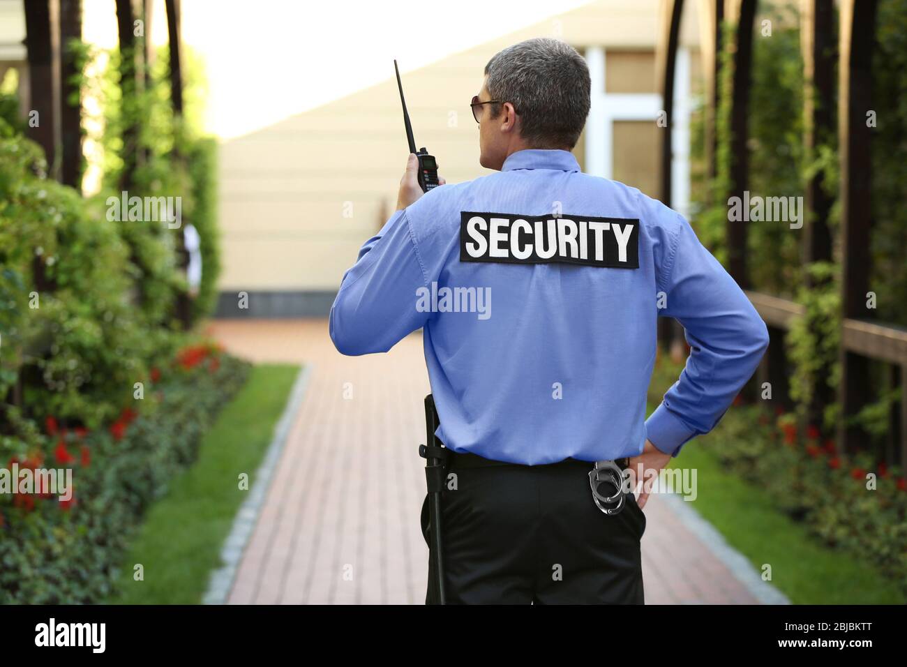 Male security guard protects hi-res stock photography and images - Alamy