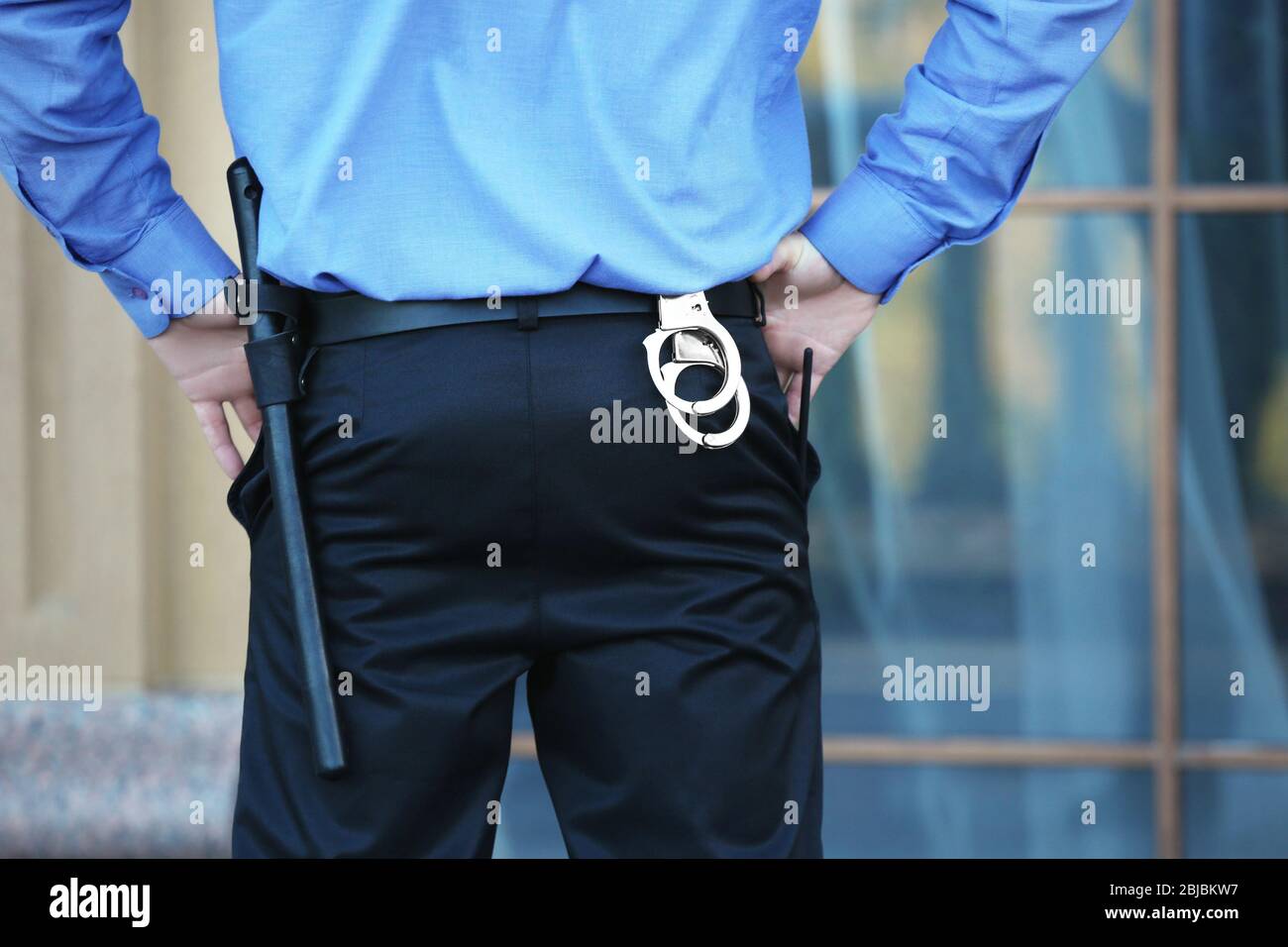 Male security guard protecting house outdoor Stock Photo - Alamy