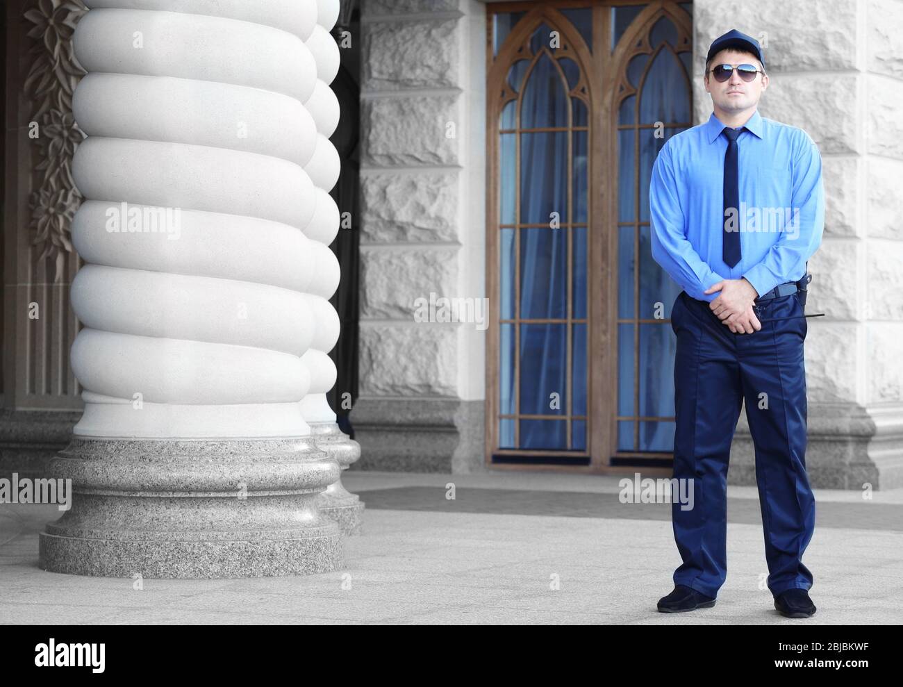 Male security guard protecting house outdoor Stock Photo - Alamy