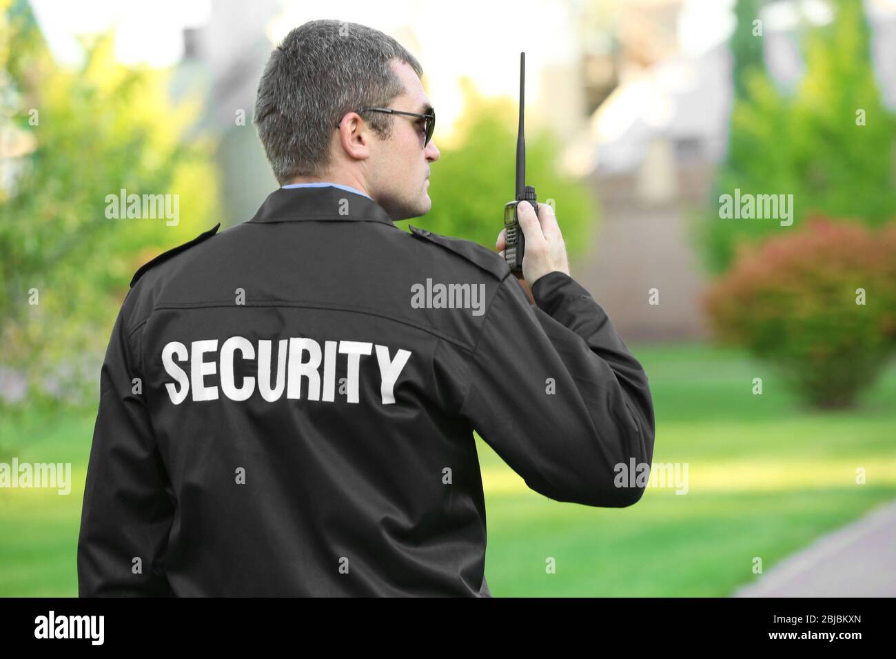 Police officer radio in park hi-res stock photography and images - Alamy