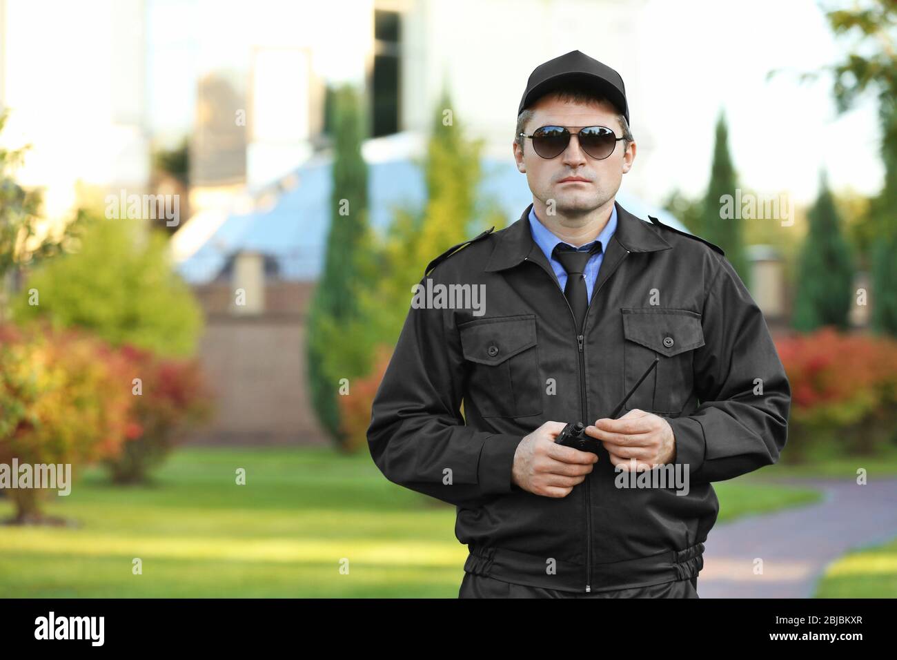 Policeman standing in park hi-res stock photography and images - Alamy