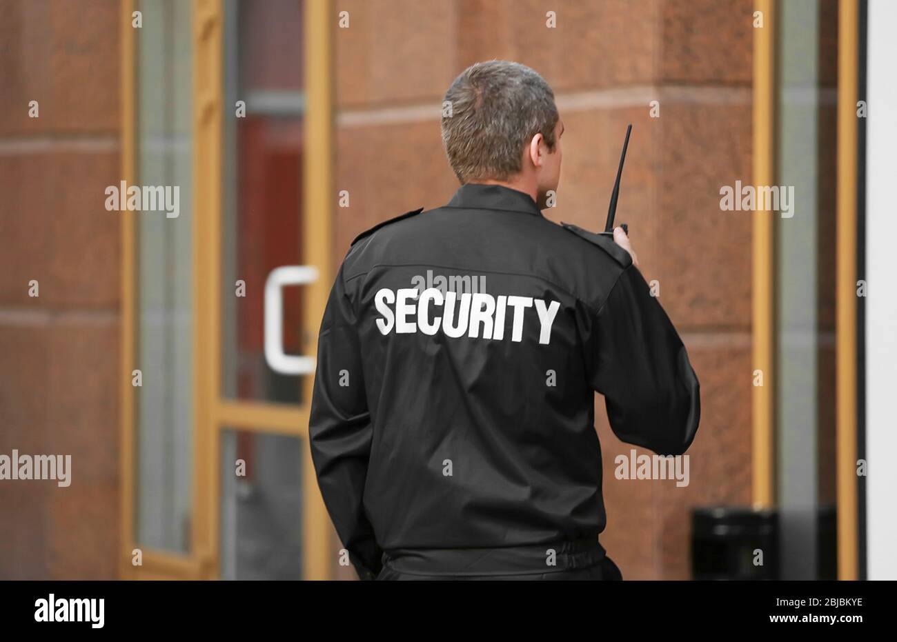 Male security guard, outdoor Stock Photo - Alamy