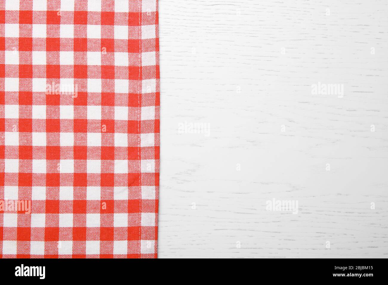 Red napkin on wooden table Stock Photo - Alamy