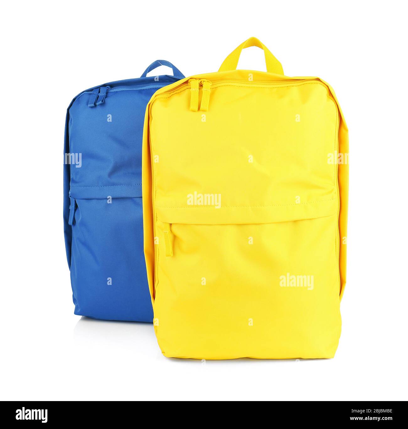 Yellow and blue backpacks on white background Stock Photo - Alamy